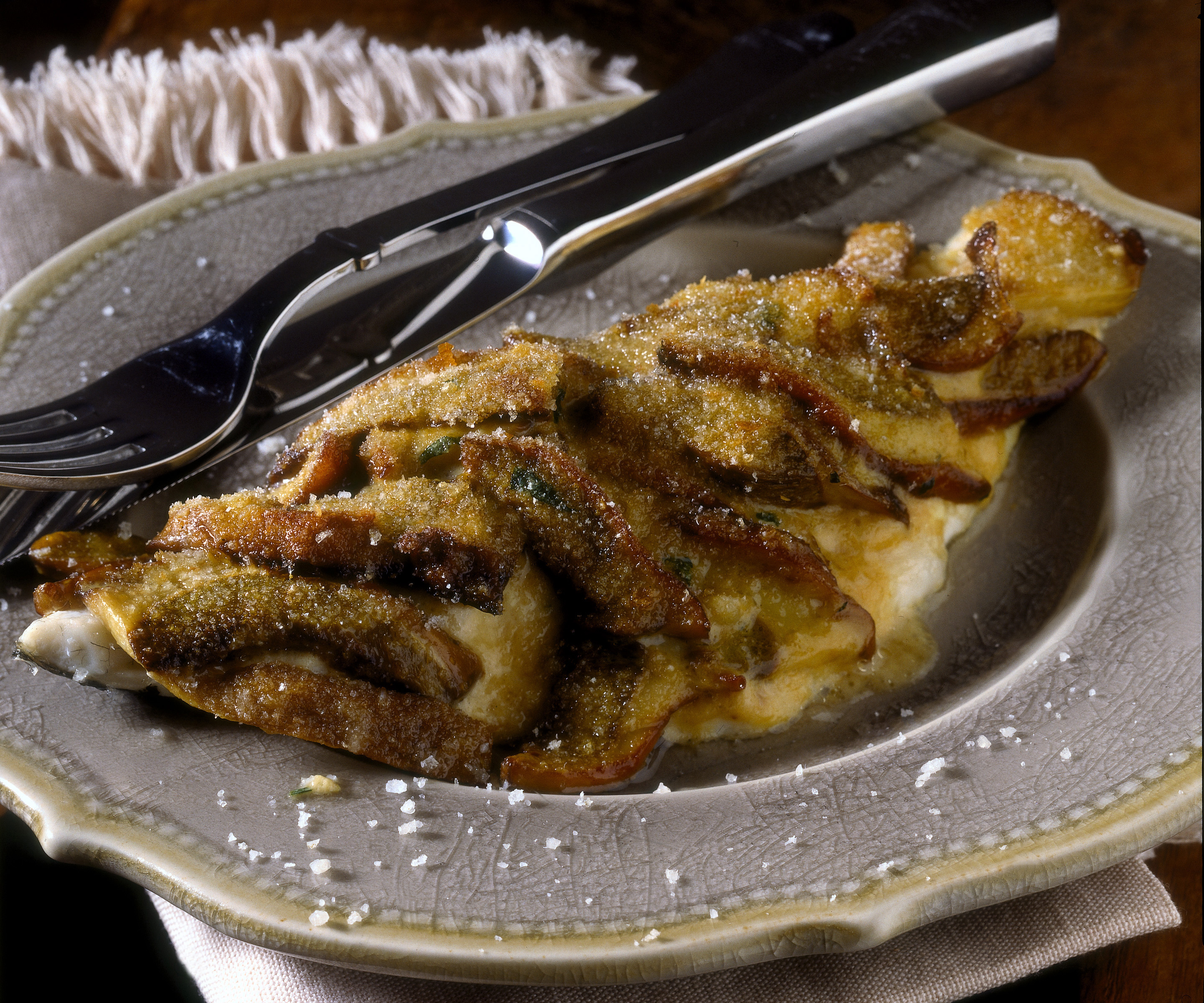 Ricetta Filetti di pesce gratinati con funghi - Donna Moderna